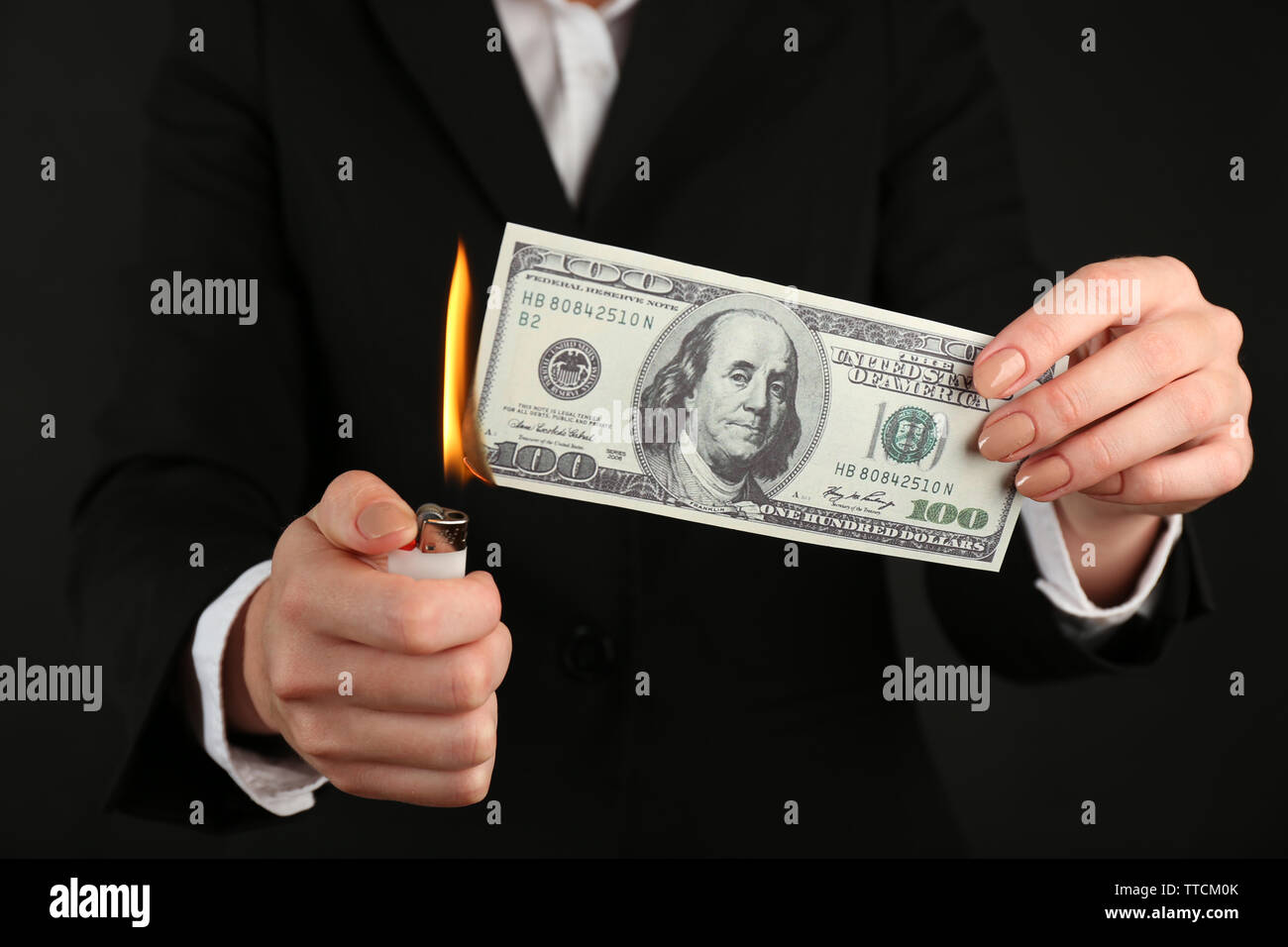Burning dollars hi-res stock photography and images - Alamy