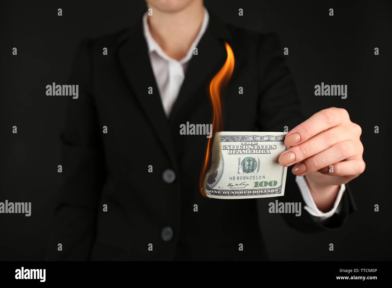 Burning dollars hi-res stock photography and images - Alamy