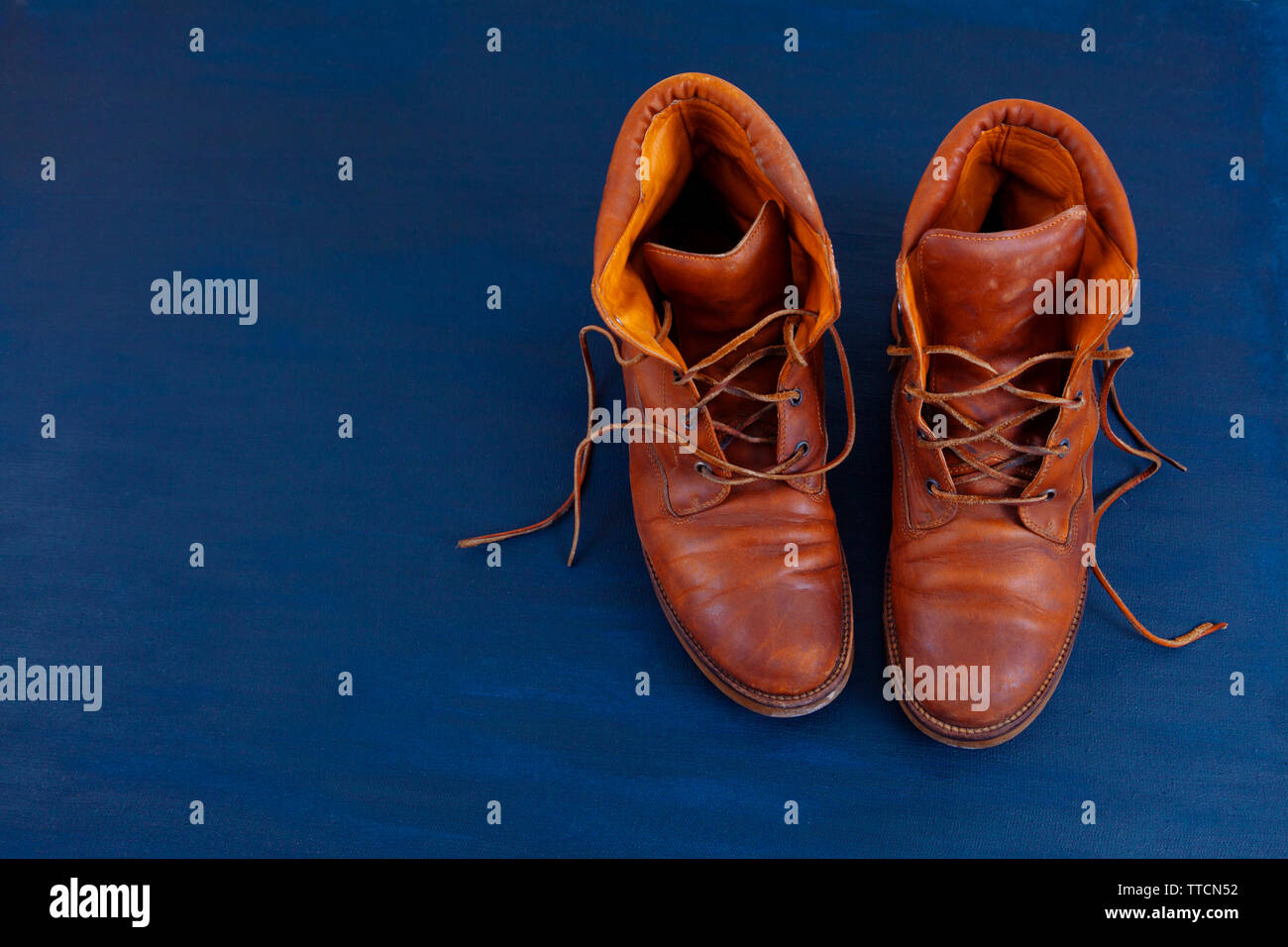 Old red dirty high shoes on blue background. Old school vintage worn ...