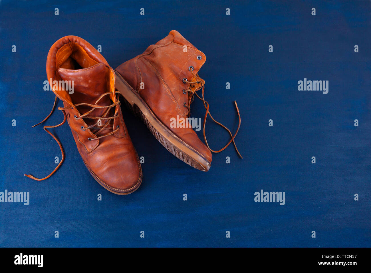 Old red dirty high shoes on blue background. Old school vintage worn ...