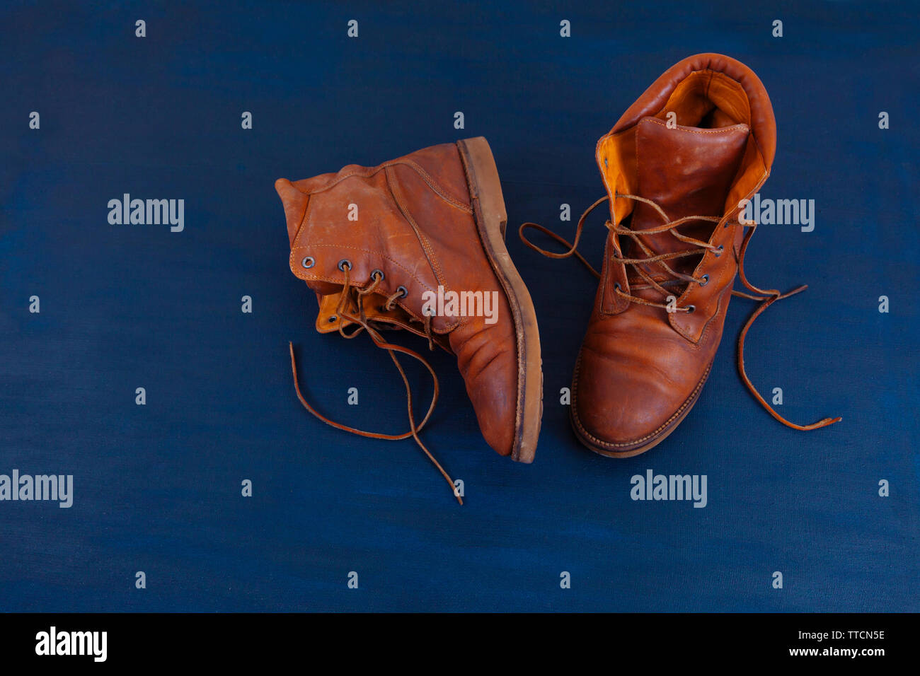 Old red dirty high shoes on blue background. Old school vintage worn ...