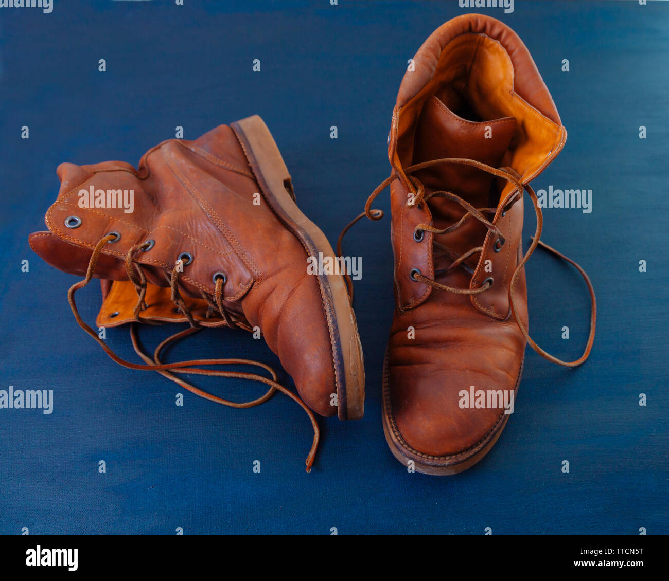 Old red dirty high shoes on blue background. Old school vintage worn ...