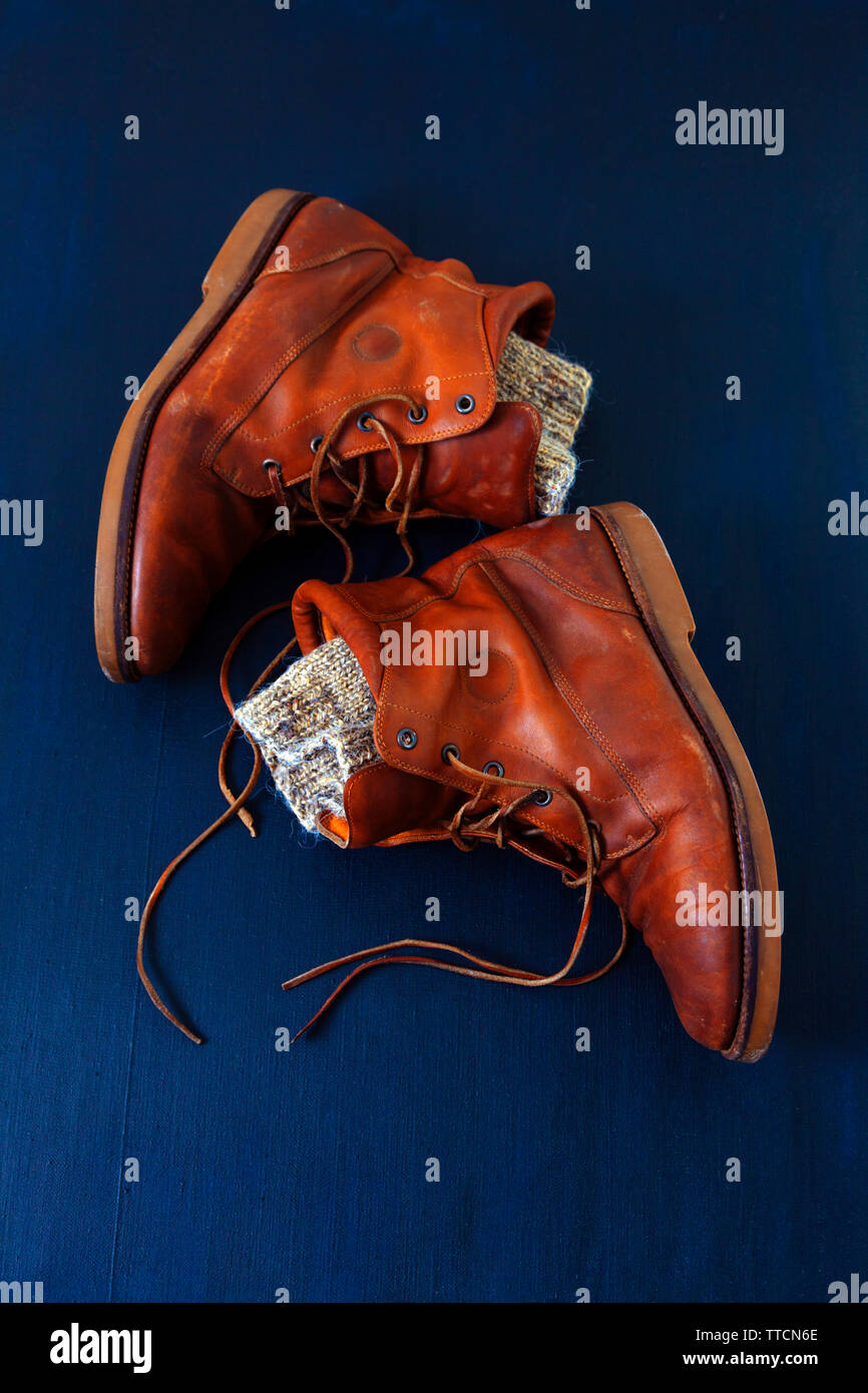 Old red dirty high shoes on blue background. Old school vintage worn ...