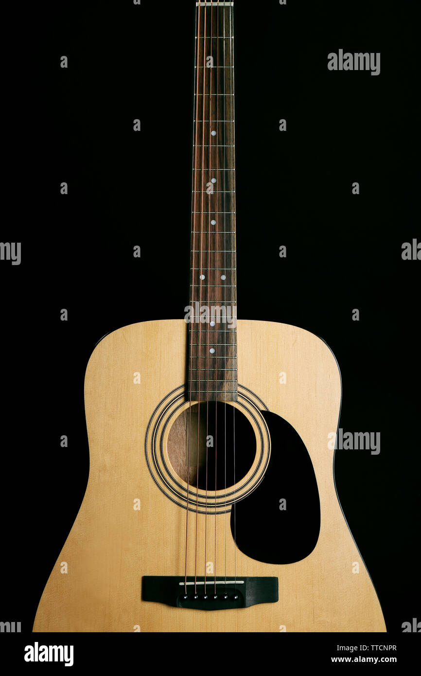 Guitar on black background Stock Photo - Alamy