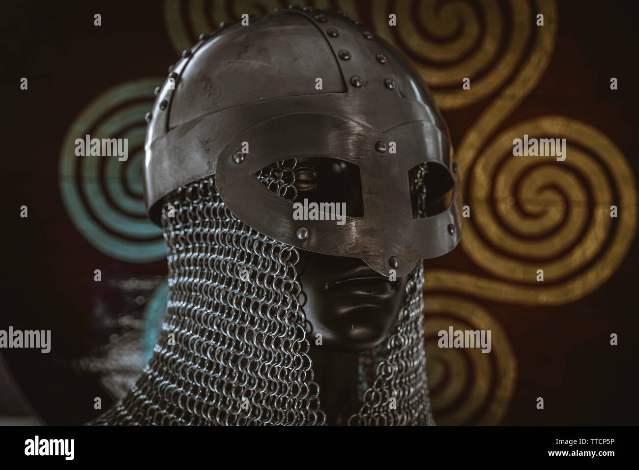 Traditional Vikings, viking helmet with chain mail on a red shield with ...