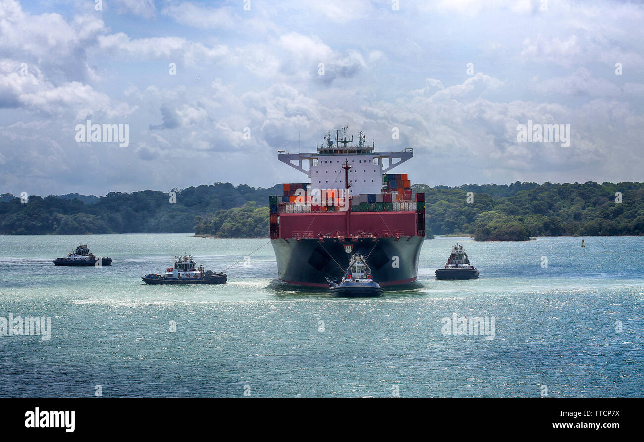 January 28, 2019, Panama Canal, Panama. Tug boats pulling large ship to ...