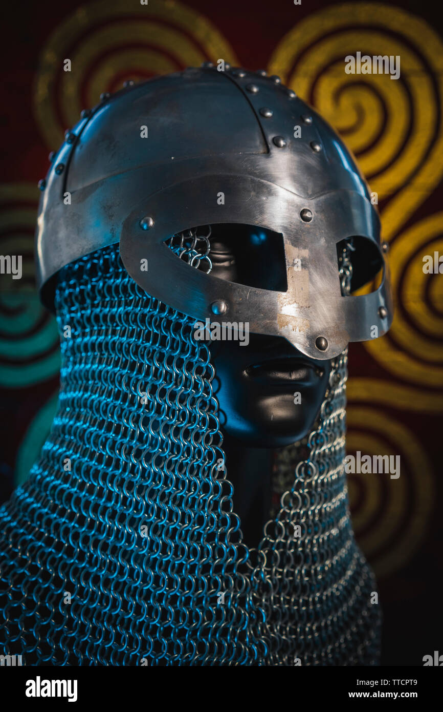 Traditional Vikings, viking helmet with chain mail on a red shield with ...
