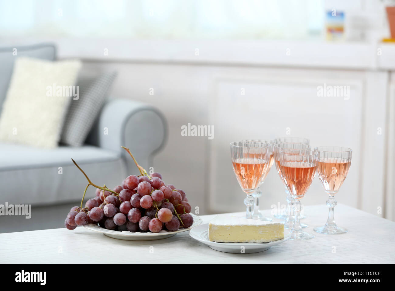 Table at home with food and drinks for friends Stock Photo - Alamy