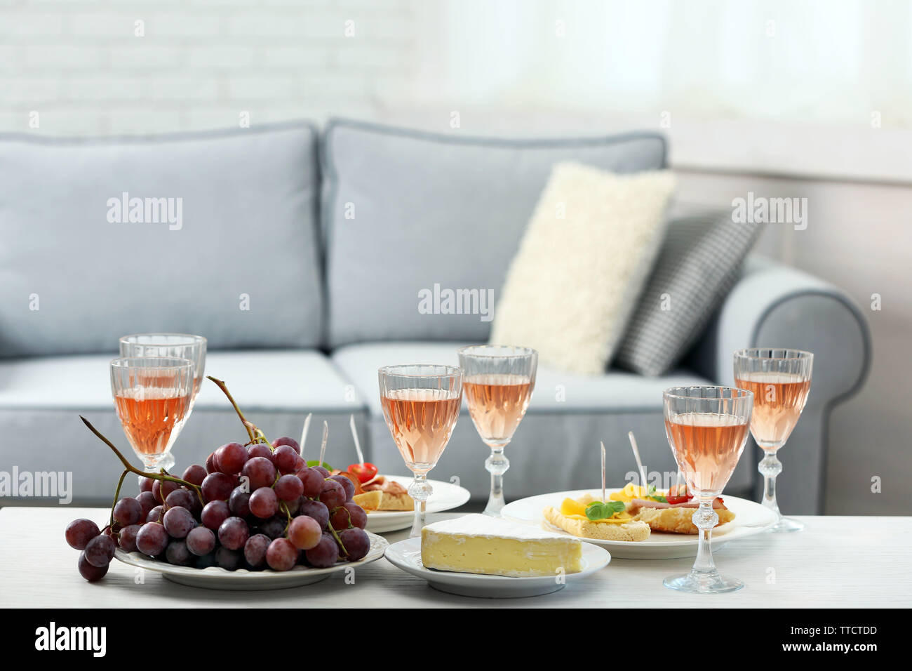 Table at home with food and drinks for friends Stock Photo - Alamy