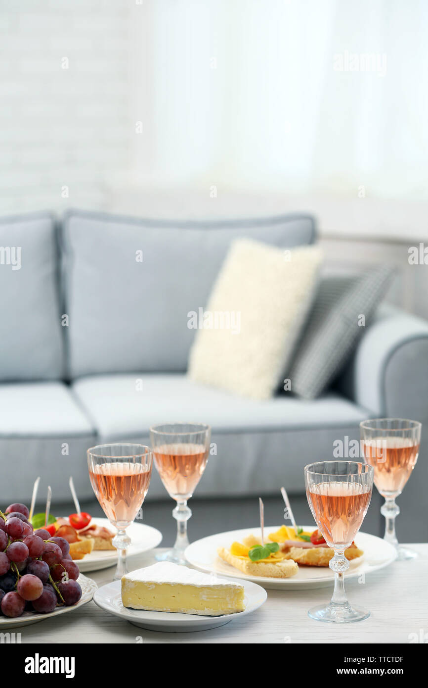 Table at home with food and drinks for friends Stock Photo - Alamy