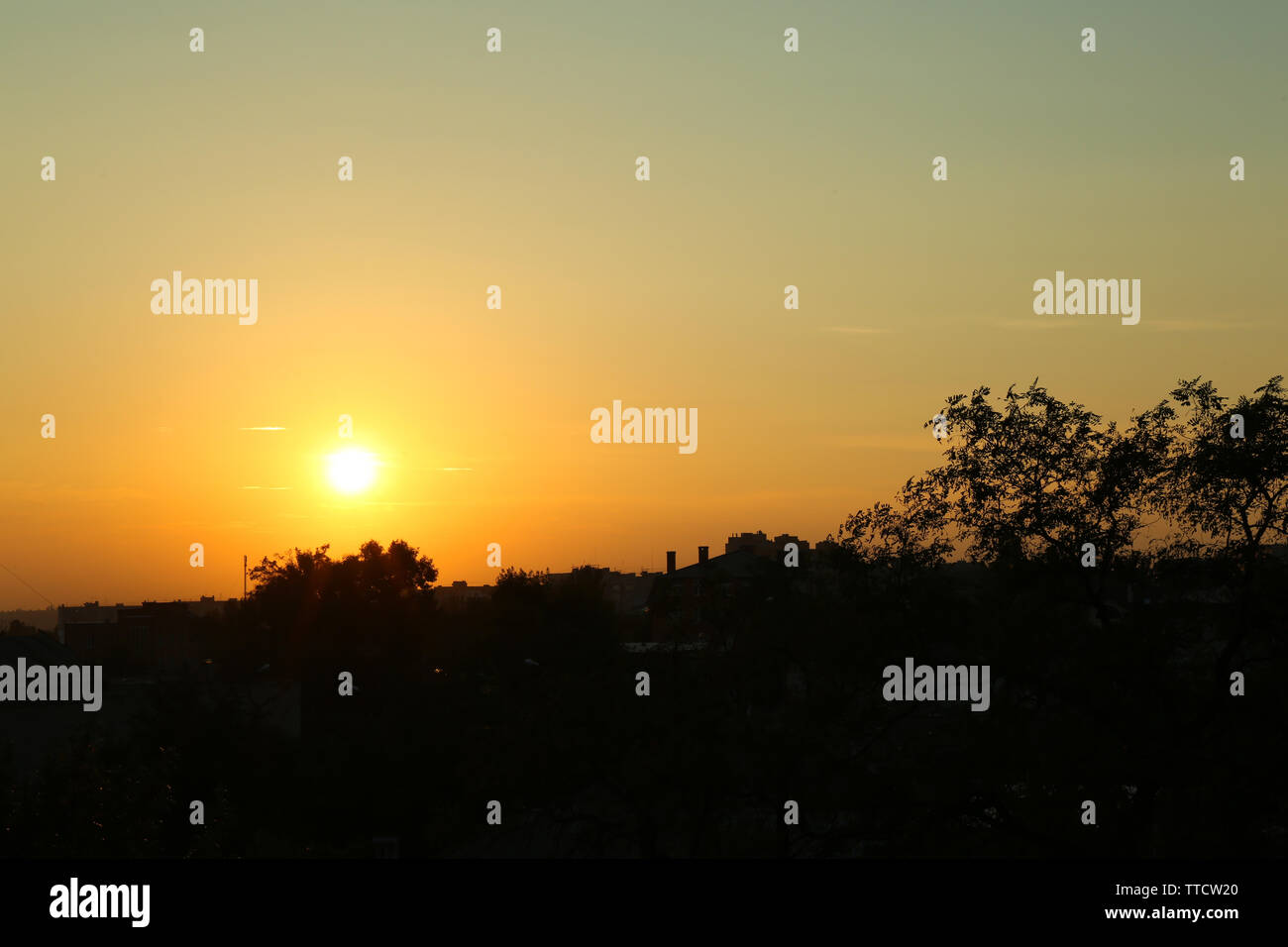 Beautiful sunset in the town Stock Photo - Alamy