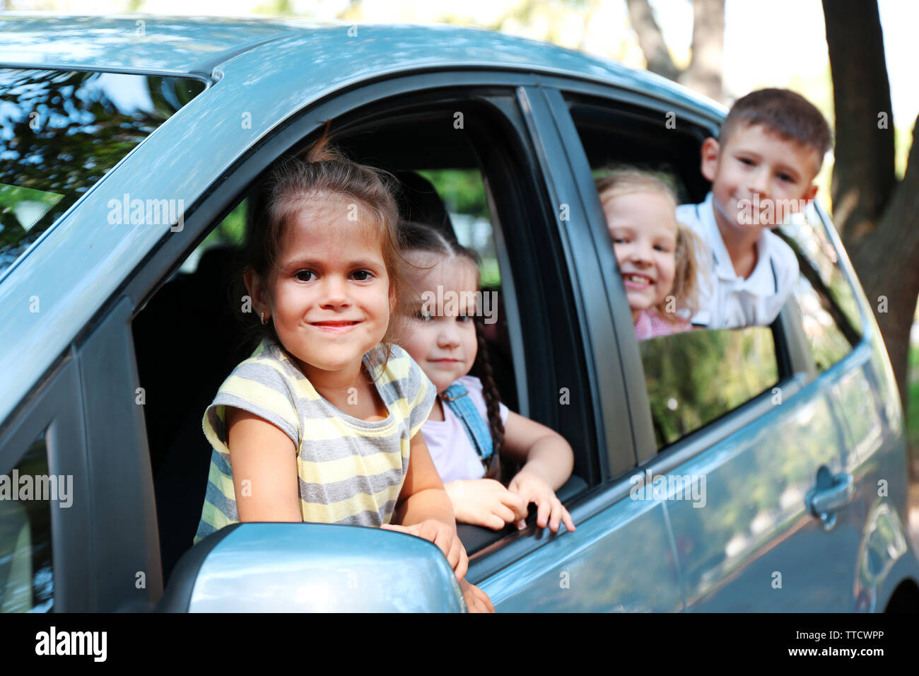 Smiling children in the car Stock Photo - Alamy