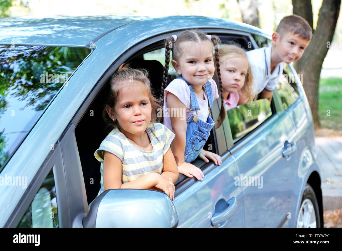 Smiling children in the car Stock Photo - Alamy