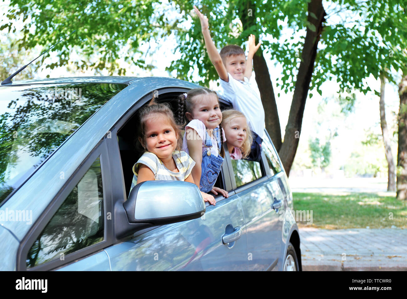 Smiling children in the car Stock Photo - Alamy