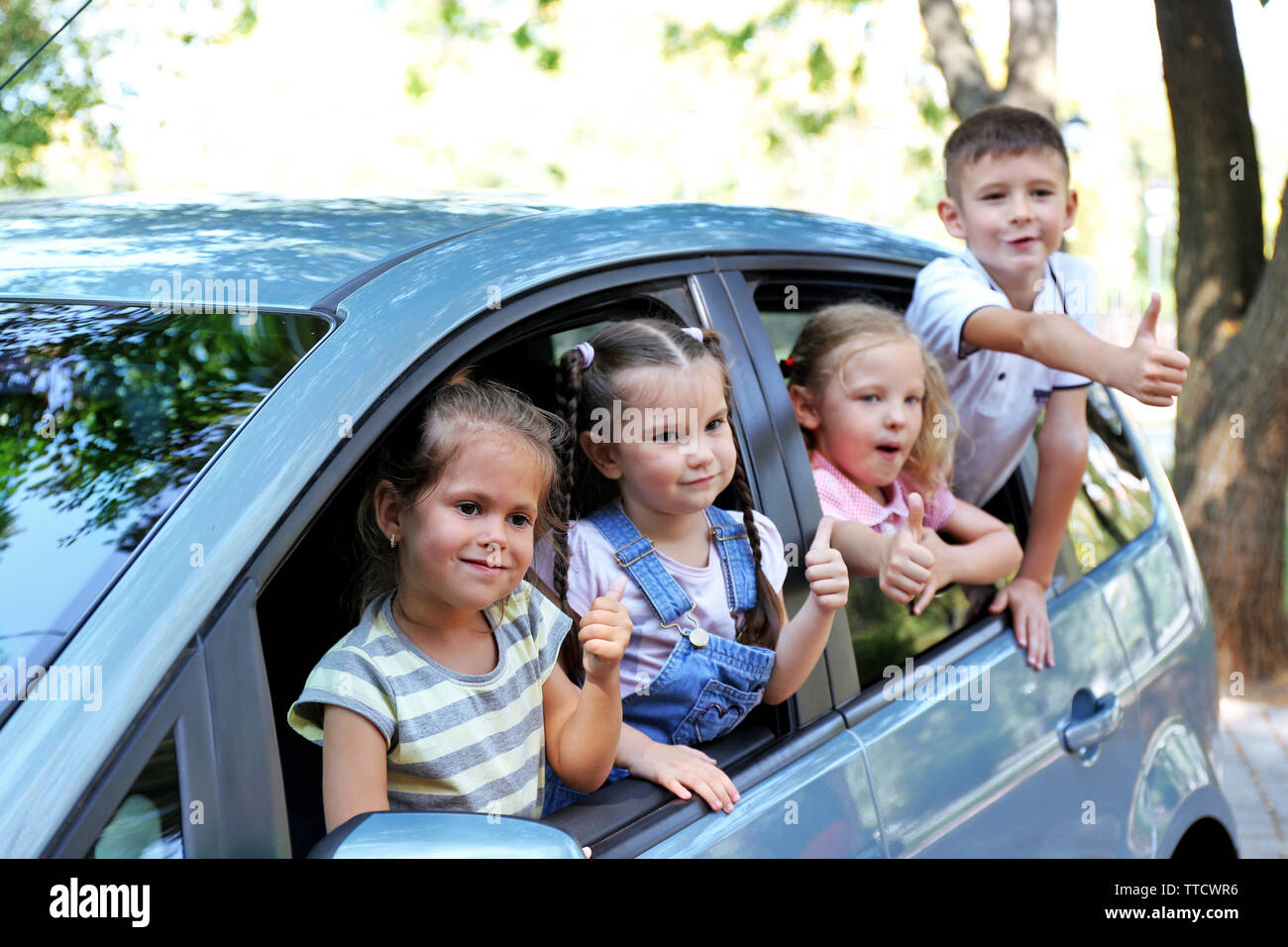 Smiling children in the car Stock Photo - Alamy