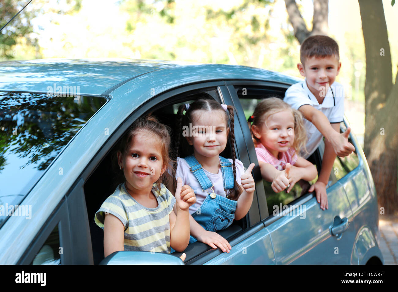 Smiling children in the car Stock Photo - Alamy