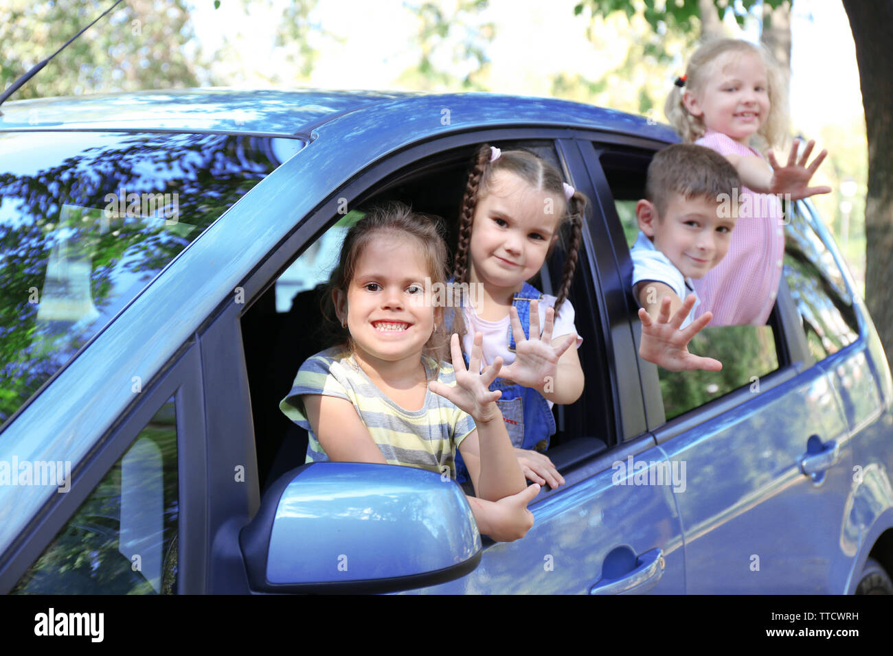 Smiling children in the car Stock Photo - Alamy