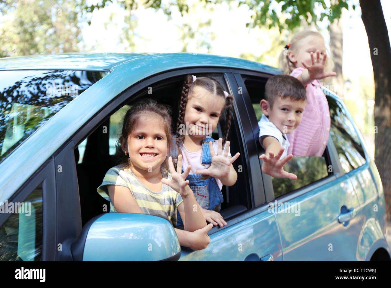 Smiling children in the car Stock Photo - Alamy