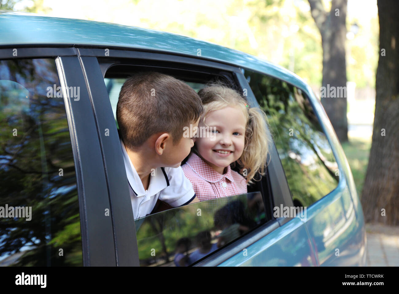 Smiling children in the car Stock Photo - Alamy
