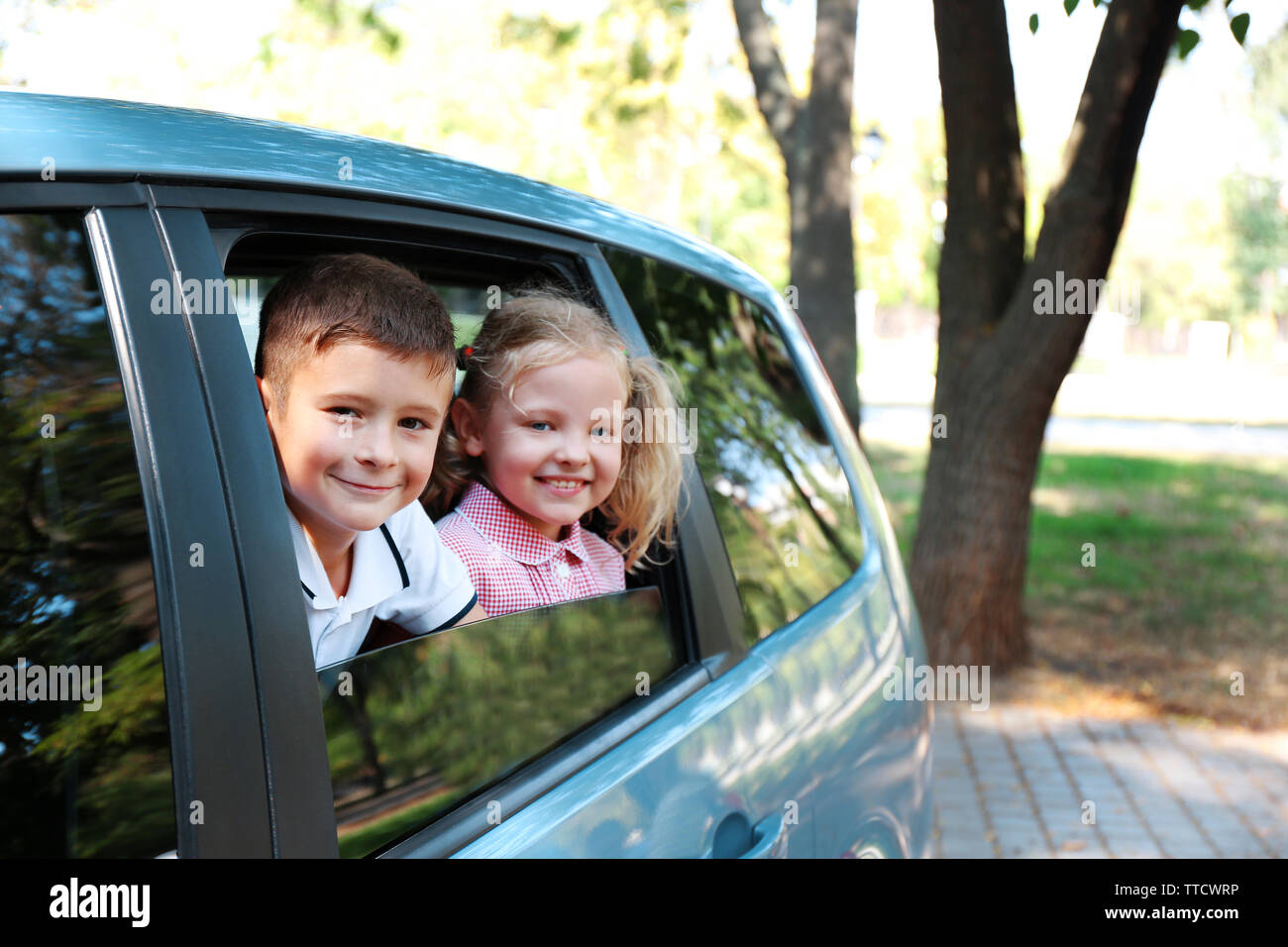 Smiling children in the car Stock Photo - Alamy