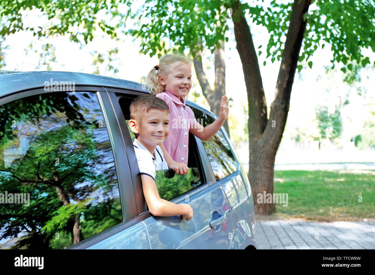 Smiling children in the car Stock Photo - Alamy