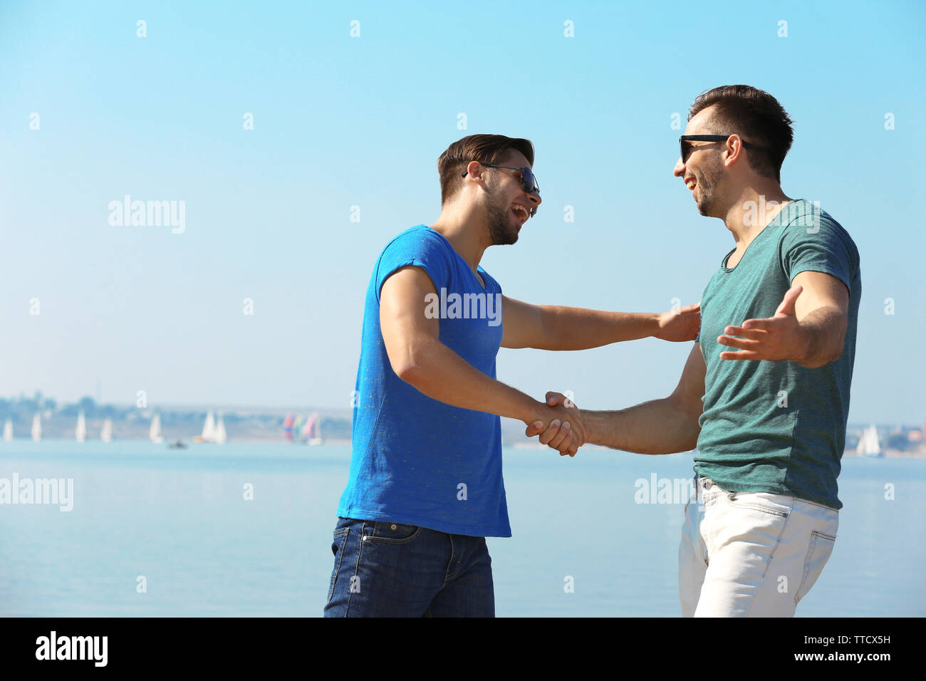 Two friends meeting sunset hi-res stock photography and images - Alamy