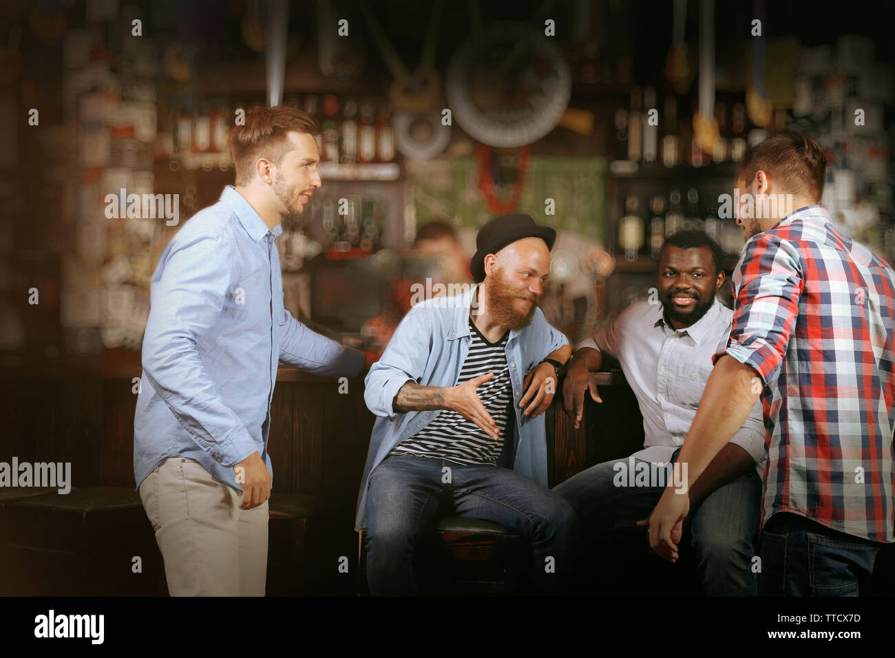 Young people having fun in a bar Stock Photo - Alamy