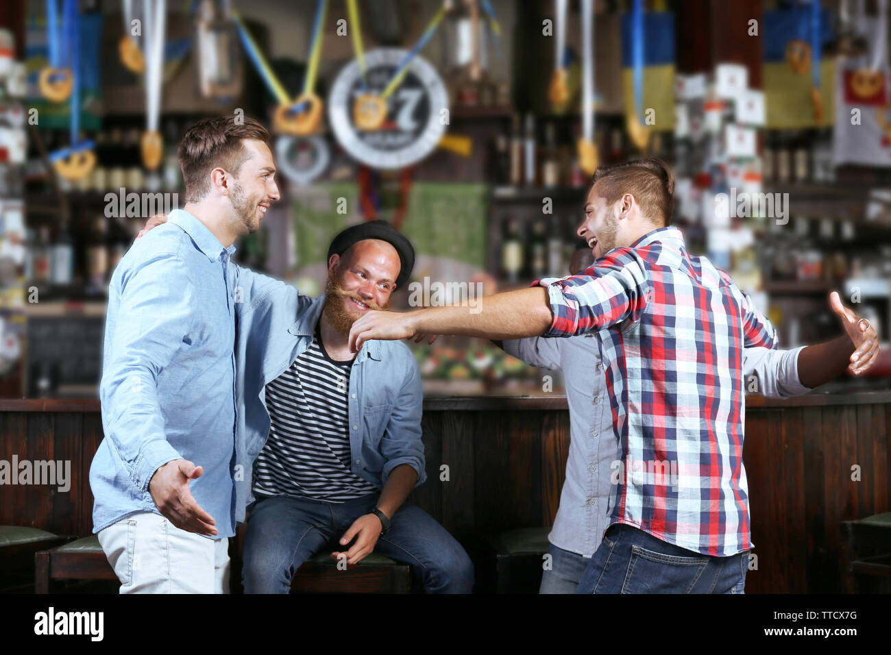 Young people having fun in a bar Stock Photo - Alamy
