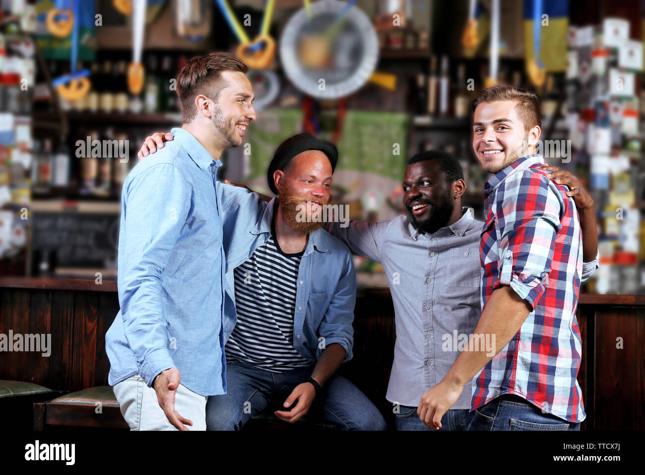 Young people having fun in a bar Stock Photo - Alamy