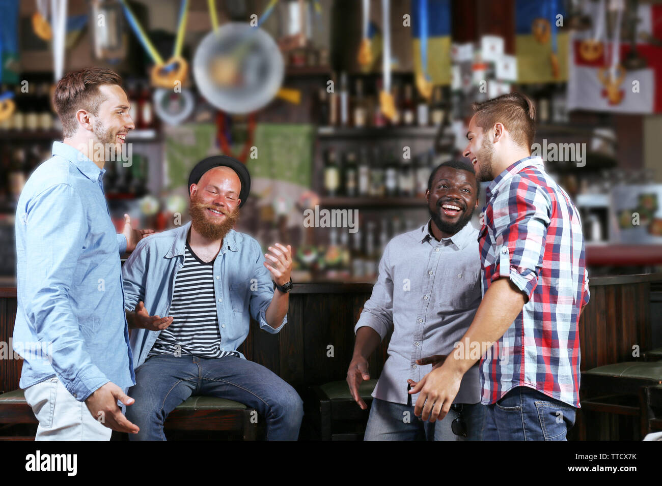 Young people having fun in a bar Stock Photo - Alamy