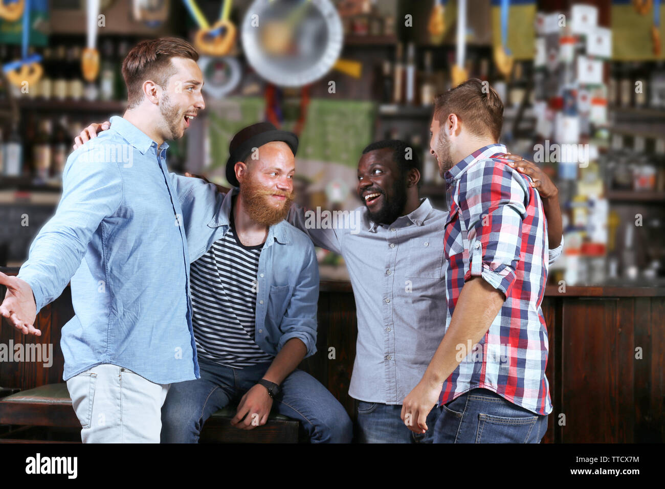 Young people having fun in a bar Stock Photo - Alamy