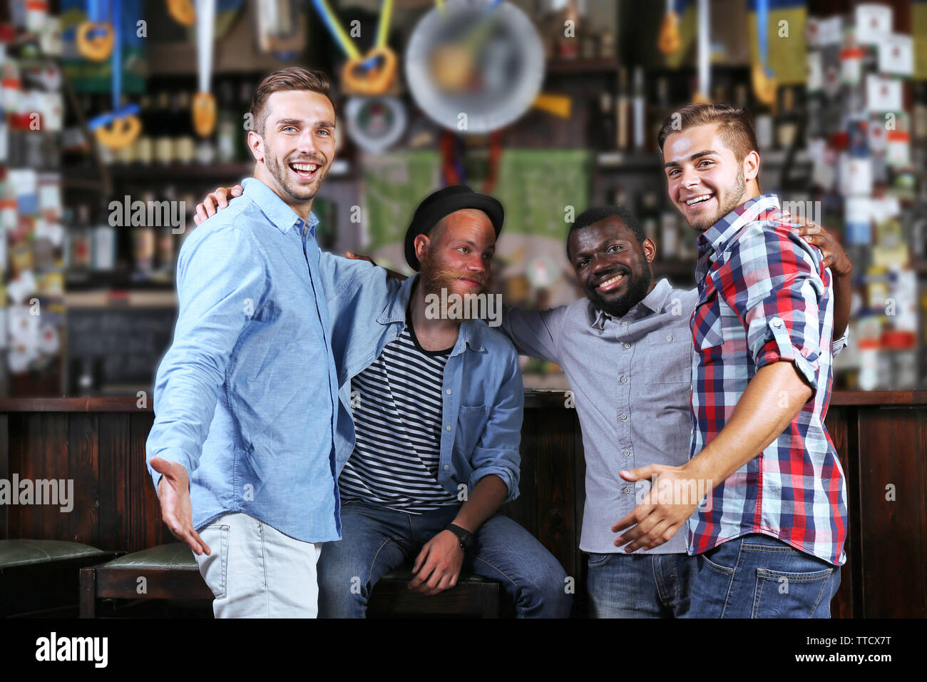 Young people having fun in a bar Stock Photo - Alamy