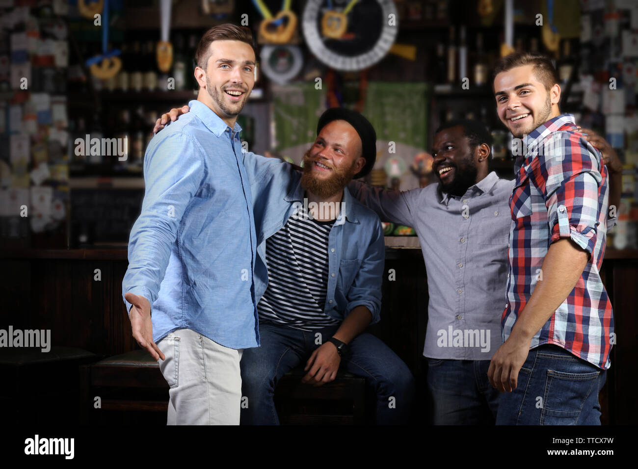 Young people having fun in a bar Stock Photo - Alamy
