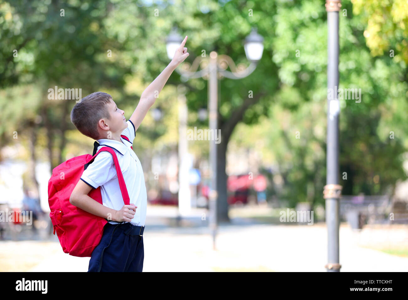 Little boy with large school bag, outdoor Stock Photo - Alamy