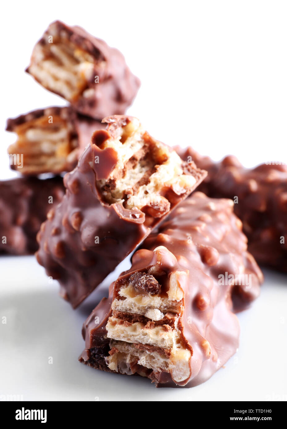 Broken crispy candy bars, isolated on white Stock Photo - Alamy