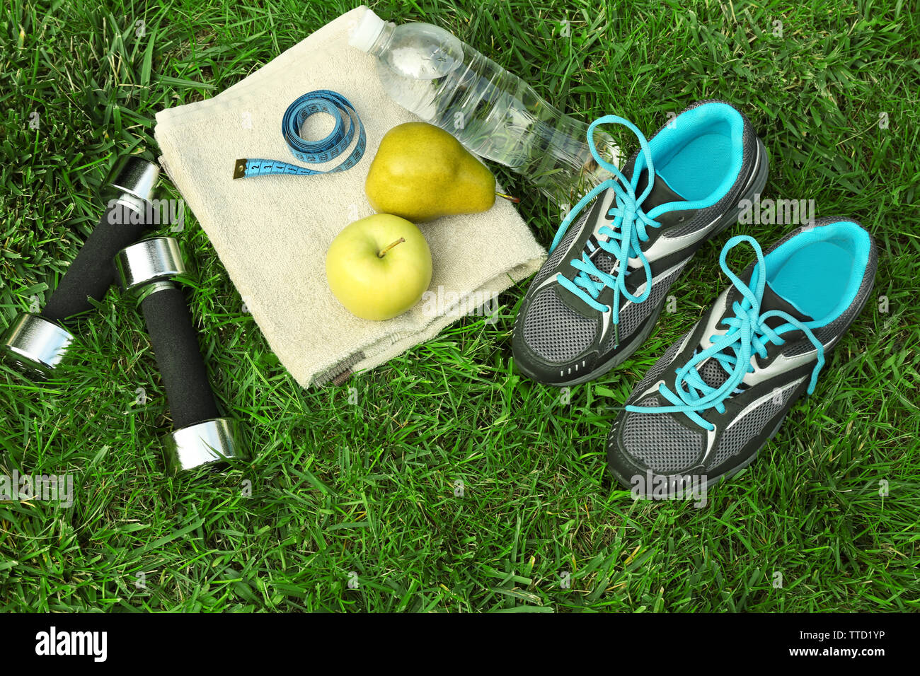 sports equipment on green grass background Stock Photo - Alamy