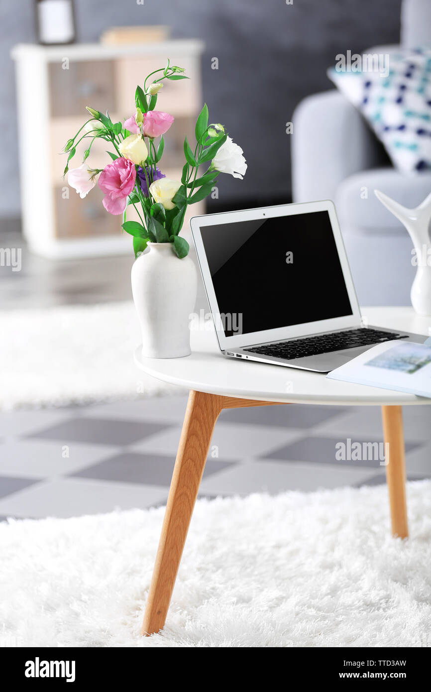 Comfortable workplace at home with laptop Stock Photo - Alamy