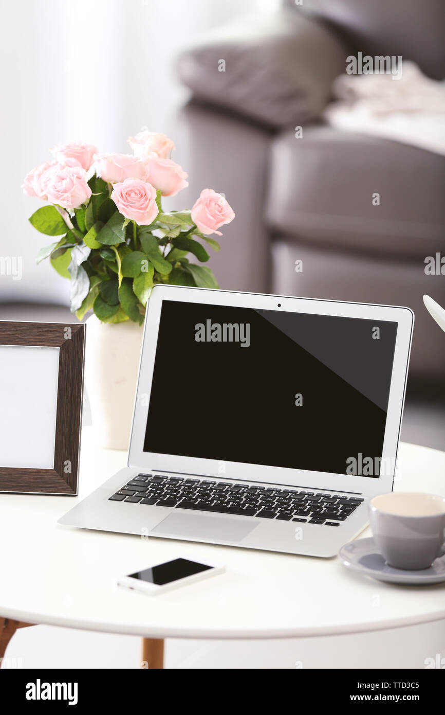 Comfortable workplace at home with laptop Stock Photo - Alamy