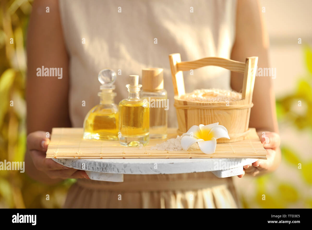 Female hands with tray of spa products, at spa salon Stock Photo - Alamy