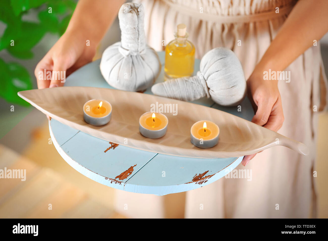 Female hands with tray of spa products, at spa salon Stock Photo - Alamy