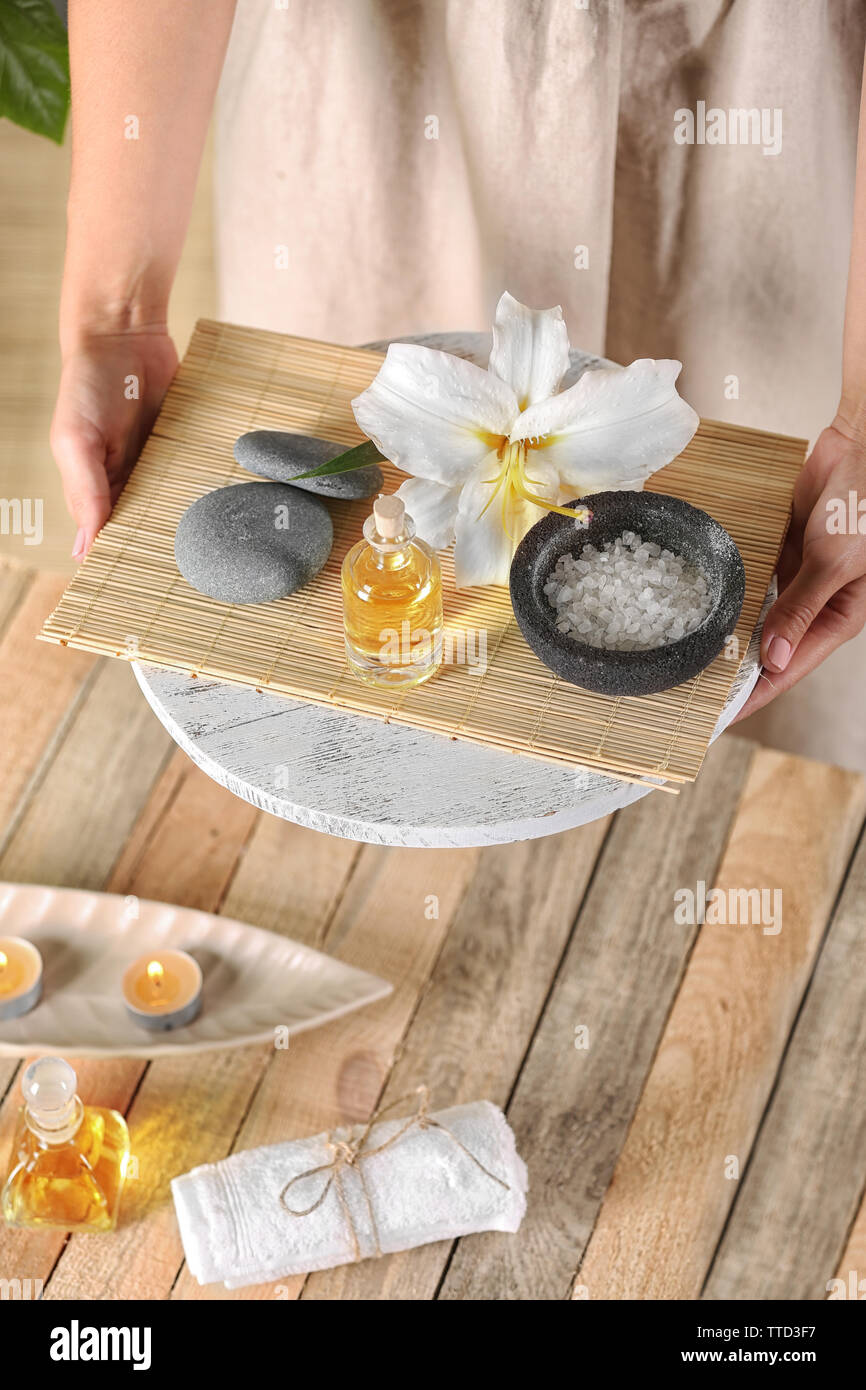 Female hands with tray of spa products, at spa salon Stock Photo - Alamy