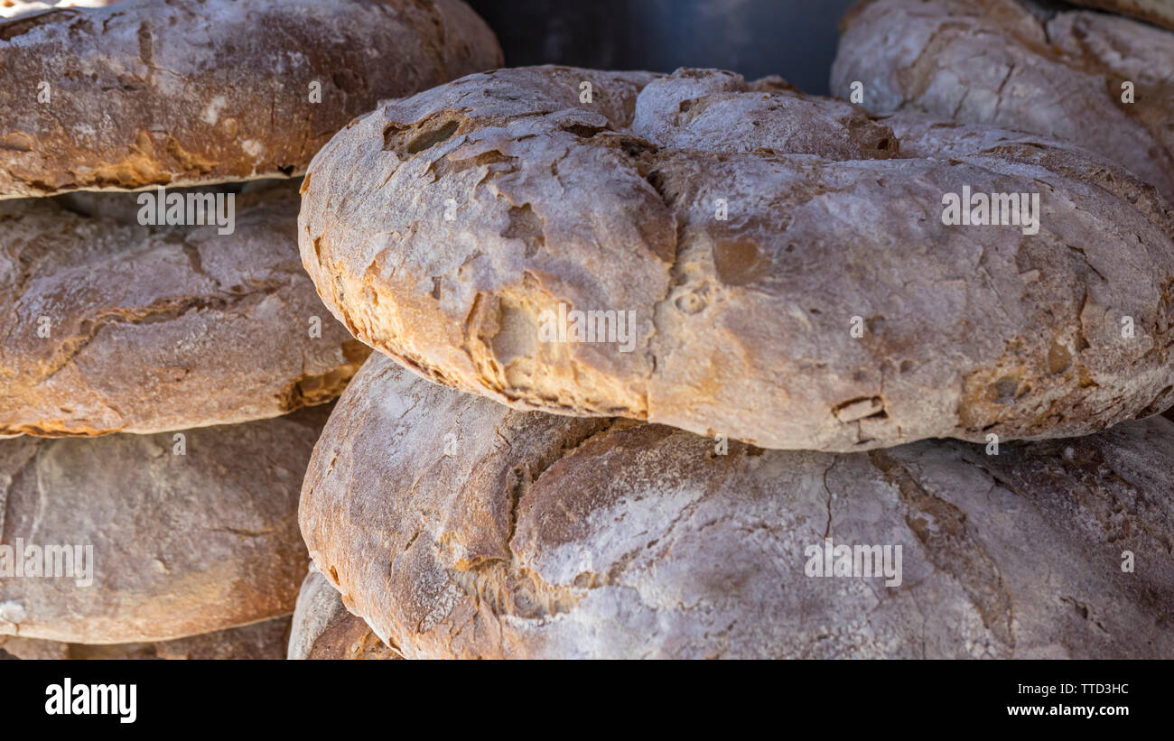 Nutrition, Artisan bread. Table with loaves of bread made by hand at a ...