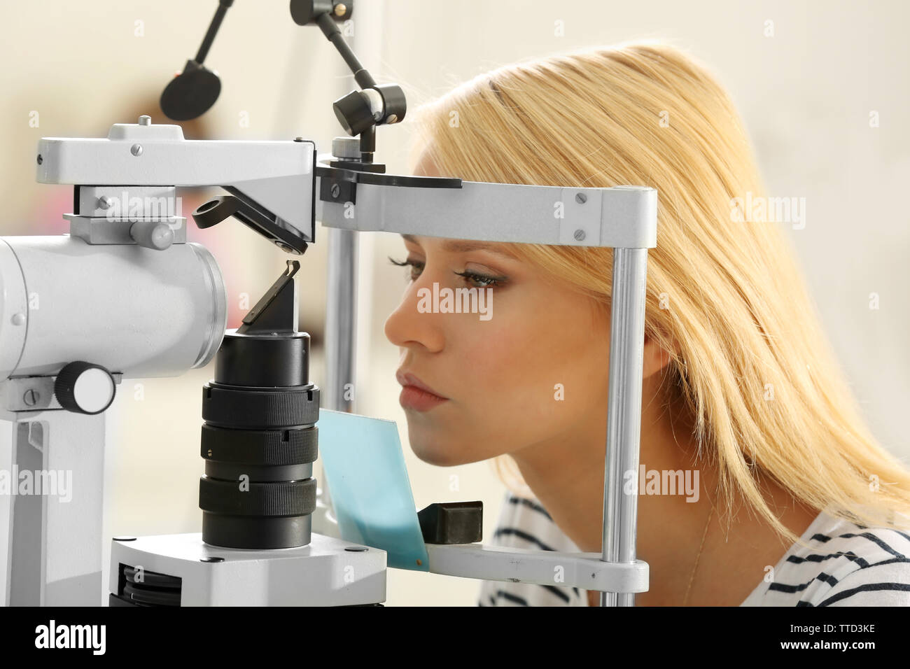 Adult female visit an optician Stock Photo - Alamy