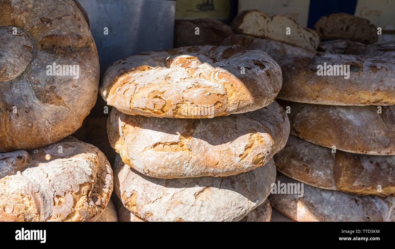 Artisan bread. Table with loaves of bread made by hand at a medieval ...