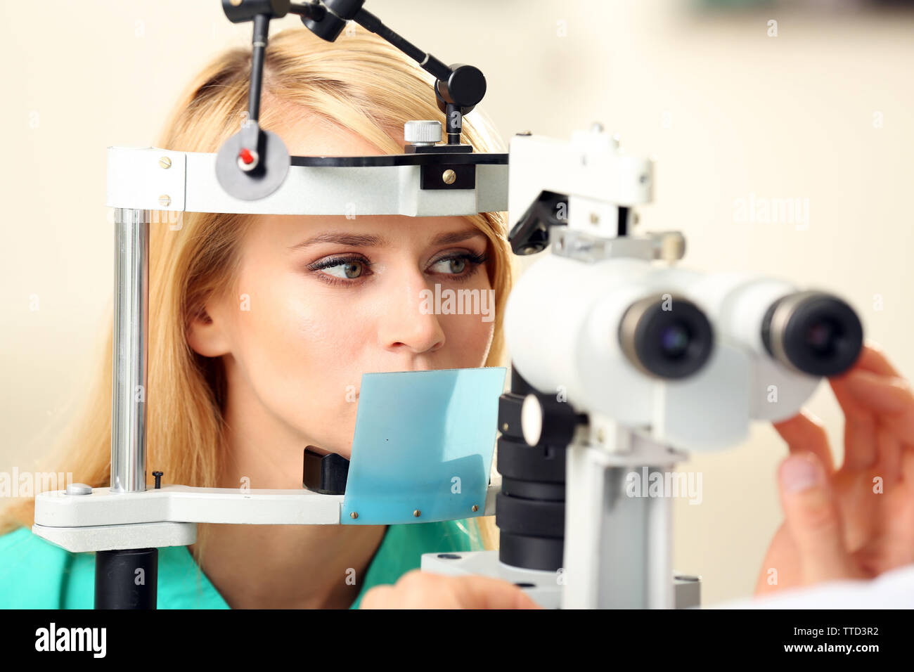 Adult female visit an optician Stock Photo - Alamy