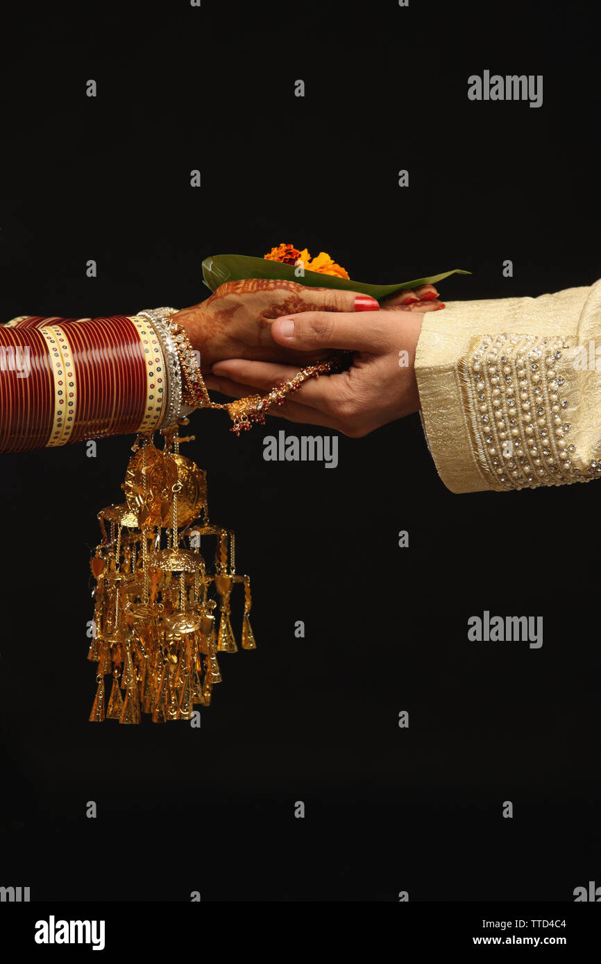 Newlywed couple performing traditional ritual Stock Photo - Alamy