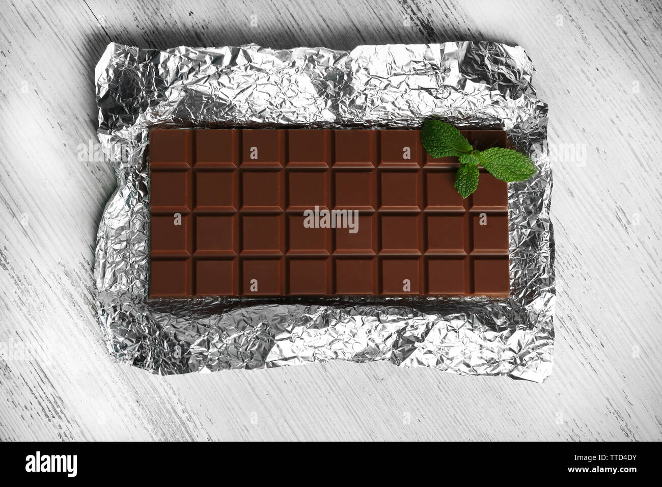 Dark Chocolate bar in foil on gray background Stock Photo - Alamy