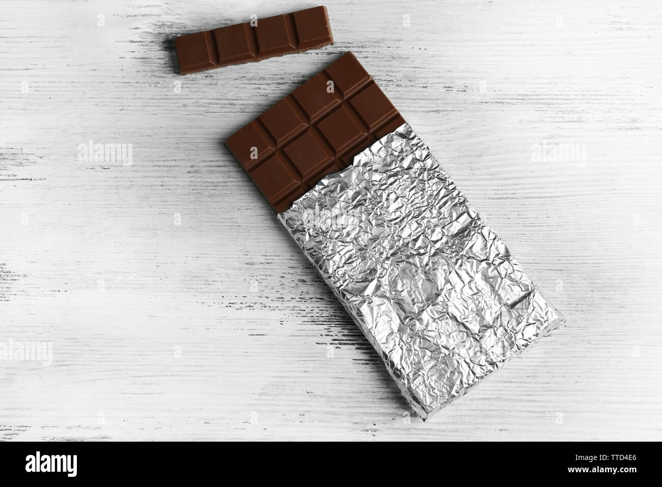 Dark Chocolate bar in foil on gray background Stock Photo - Alamy