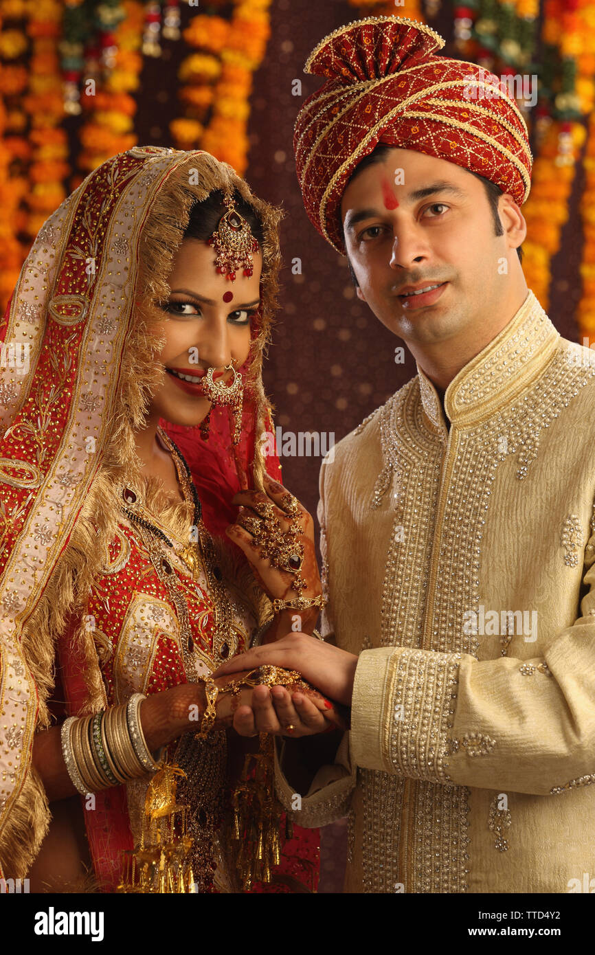Indian bride bridegroom holding hand hi-res stock photography and ...