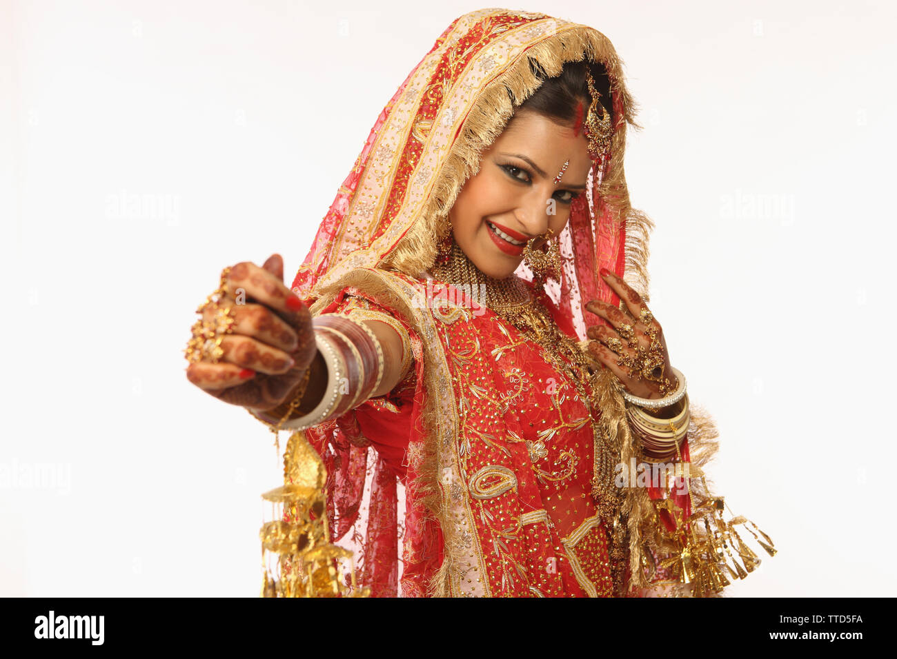 Portrait of an Indian bride in traditional wedding dress Stock Photo ...